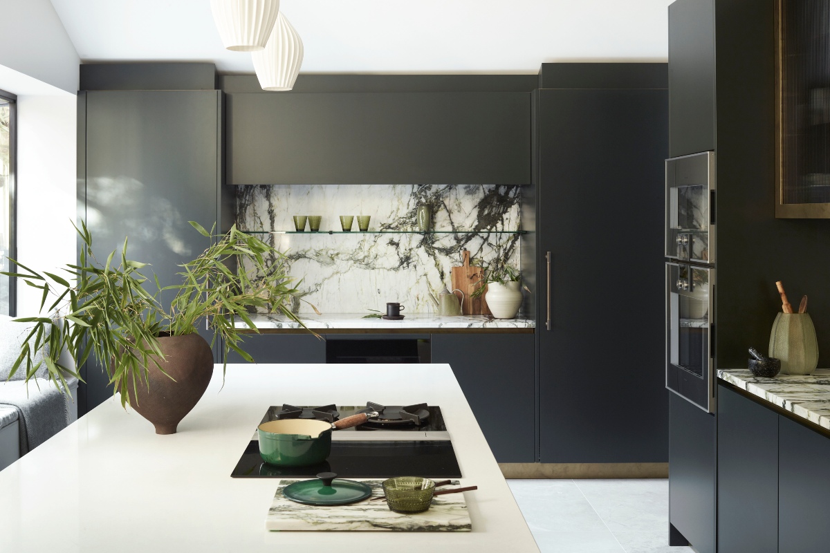Tour this dark green kitchen with statement Calacatta Verde marble