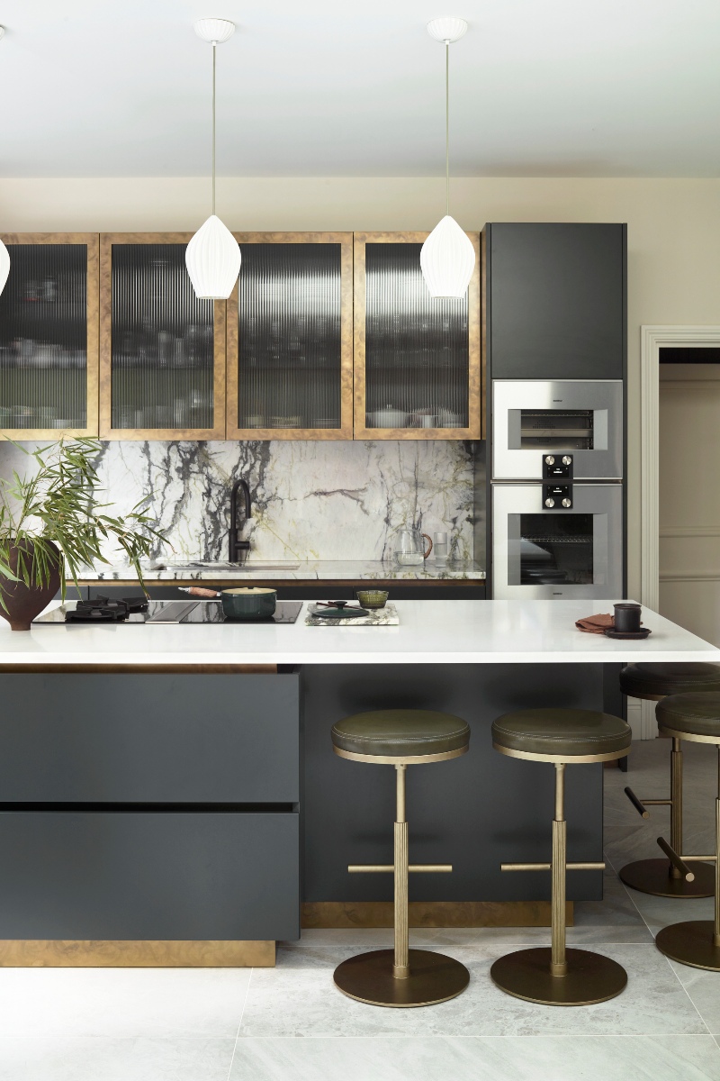 Tour this dark green kitchen with statement Calacatta Verde marble