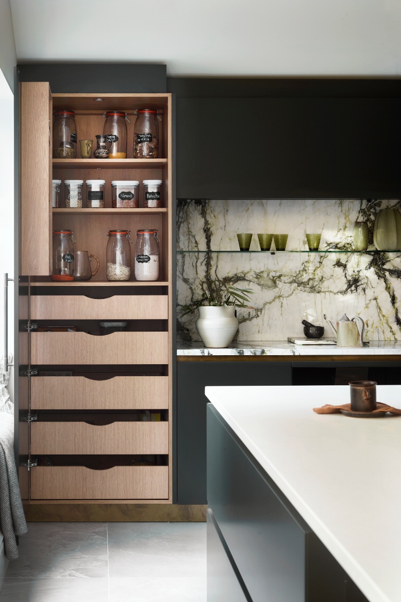 Tour this dark green kitchen with statement Calacatta Verde marble