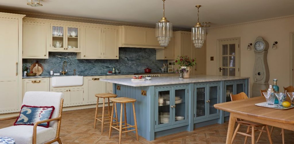 Tour this warm kitchen design with a cosy reading nook and pantry