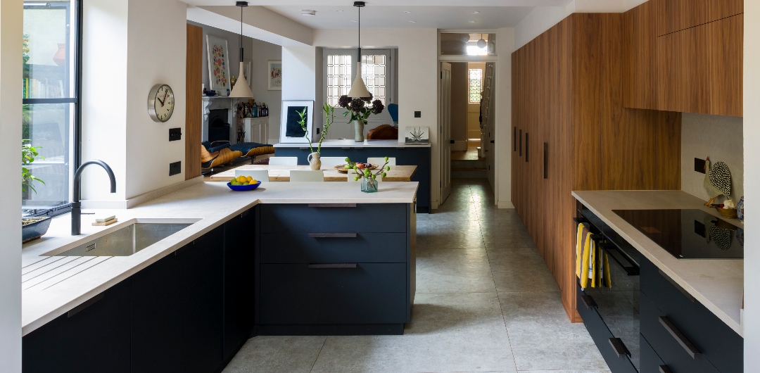 Tour this mid-century modern kitchen with black and walnut veneer